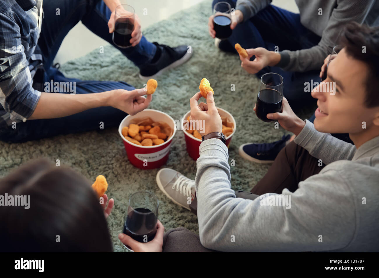 Man eating chicken nuggets hi-res stock photography and images - Alamy