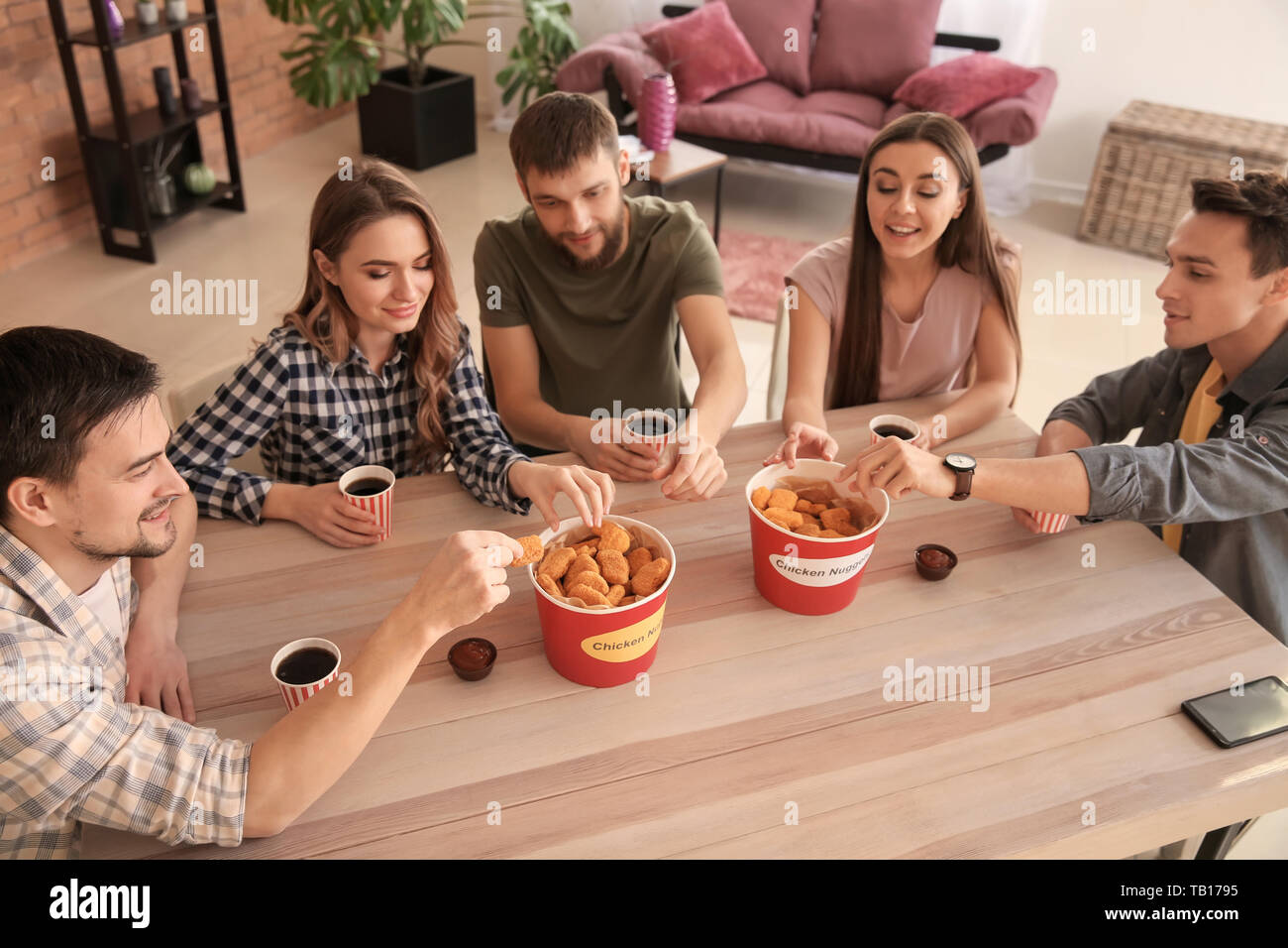 Man eating chicken nuggets hi-res stock photography and images - Alamy
