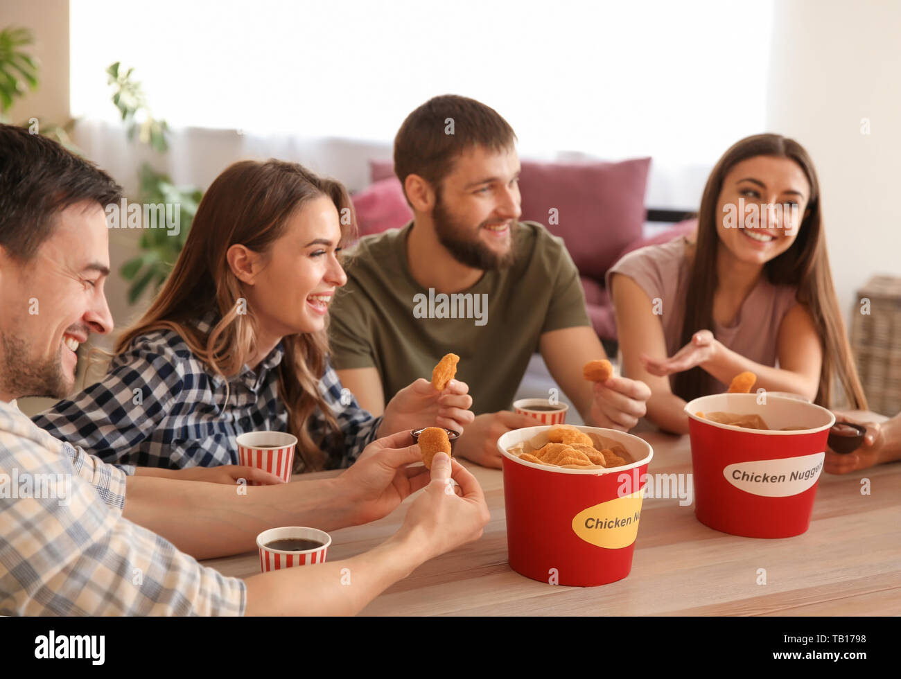 Man eating chicken nuggets hi-res stock photography and images - Alamy