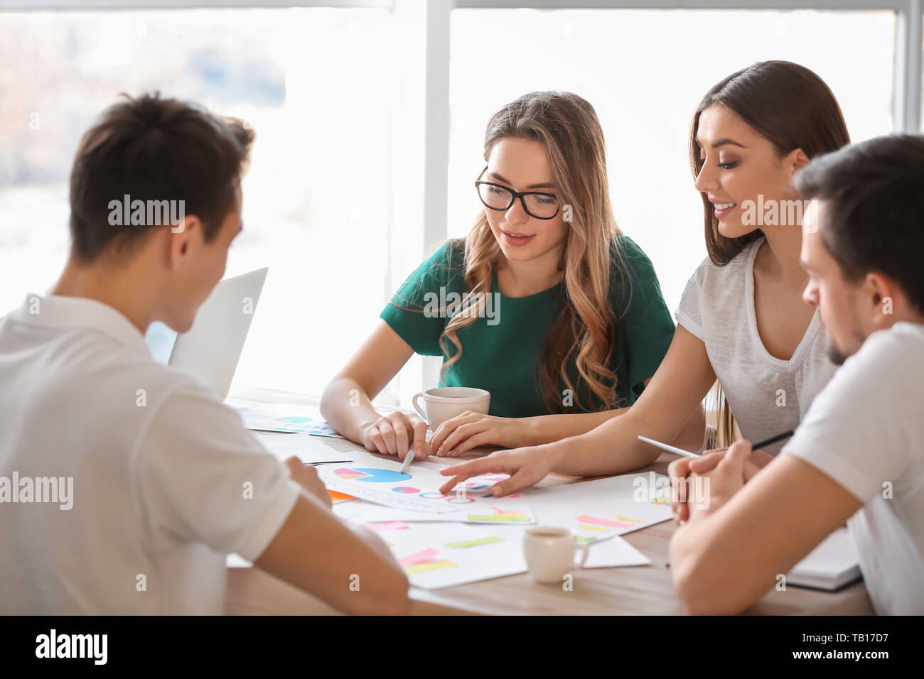 Group of people discussing business plan in office Stock Photo - Alamy