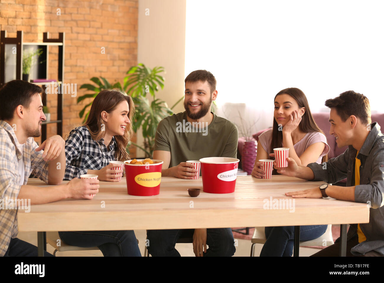 Man eating chicken nuggets hi-res stock photography and images - Alamy