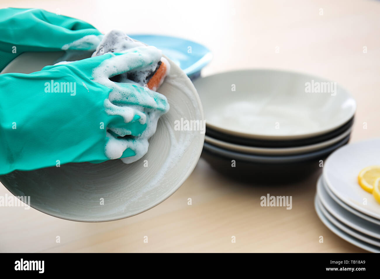 Woman washing dishes in kitchen Stock Photo - Alamy