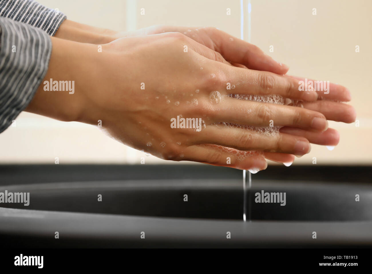 Handwashing in sink hi-res stock photography and images - Alamy