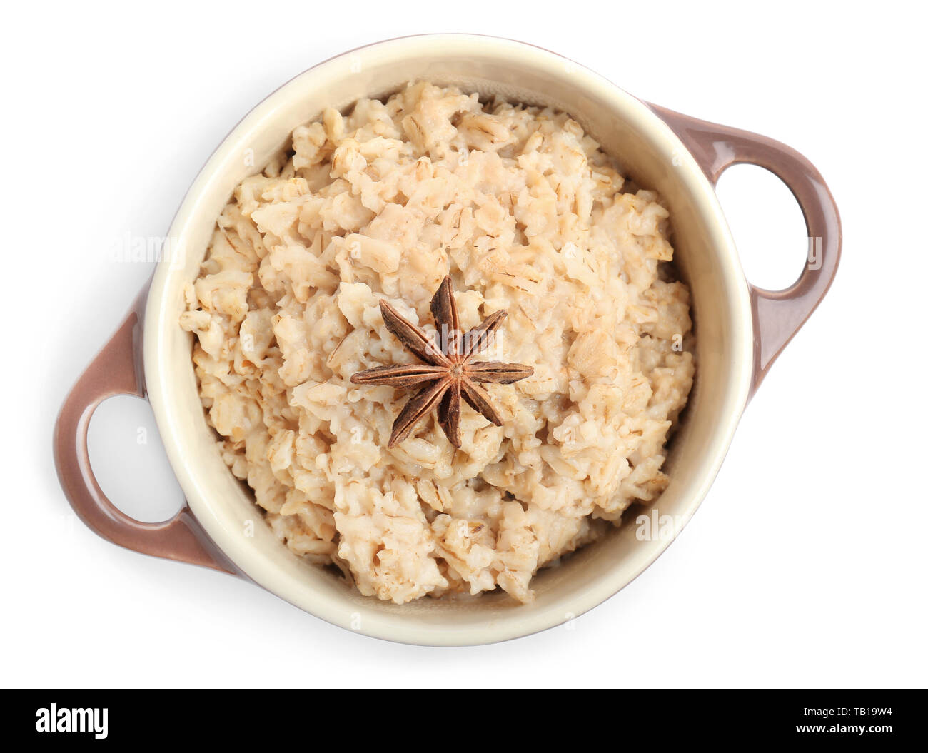 Pot with tasty oatmeal on white background Stock Photo - Alamy