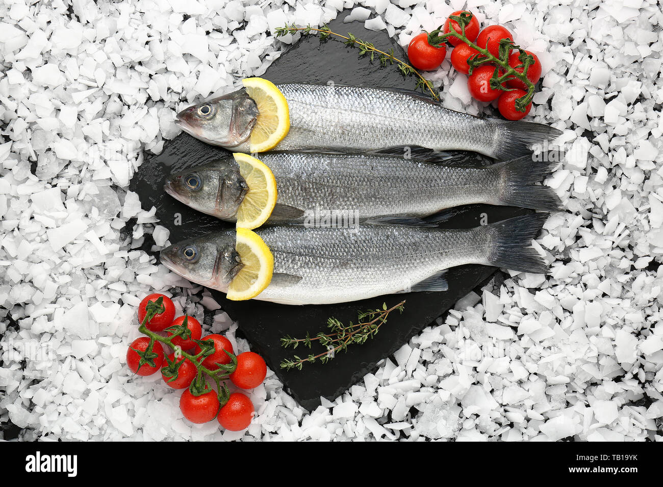 Tasty fresh seabass fish with salt Stock Photo - Alamy