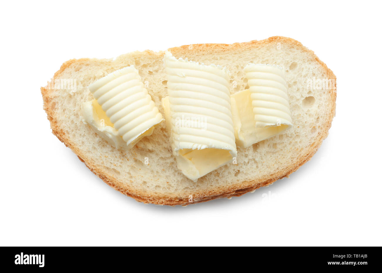 Slice of bread with butter curls on white background Stock Photo - Alamy
