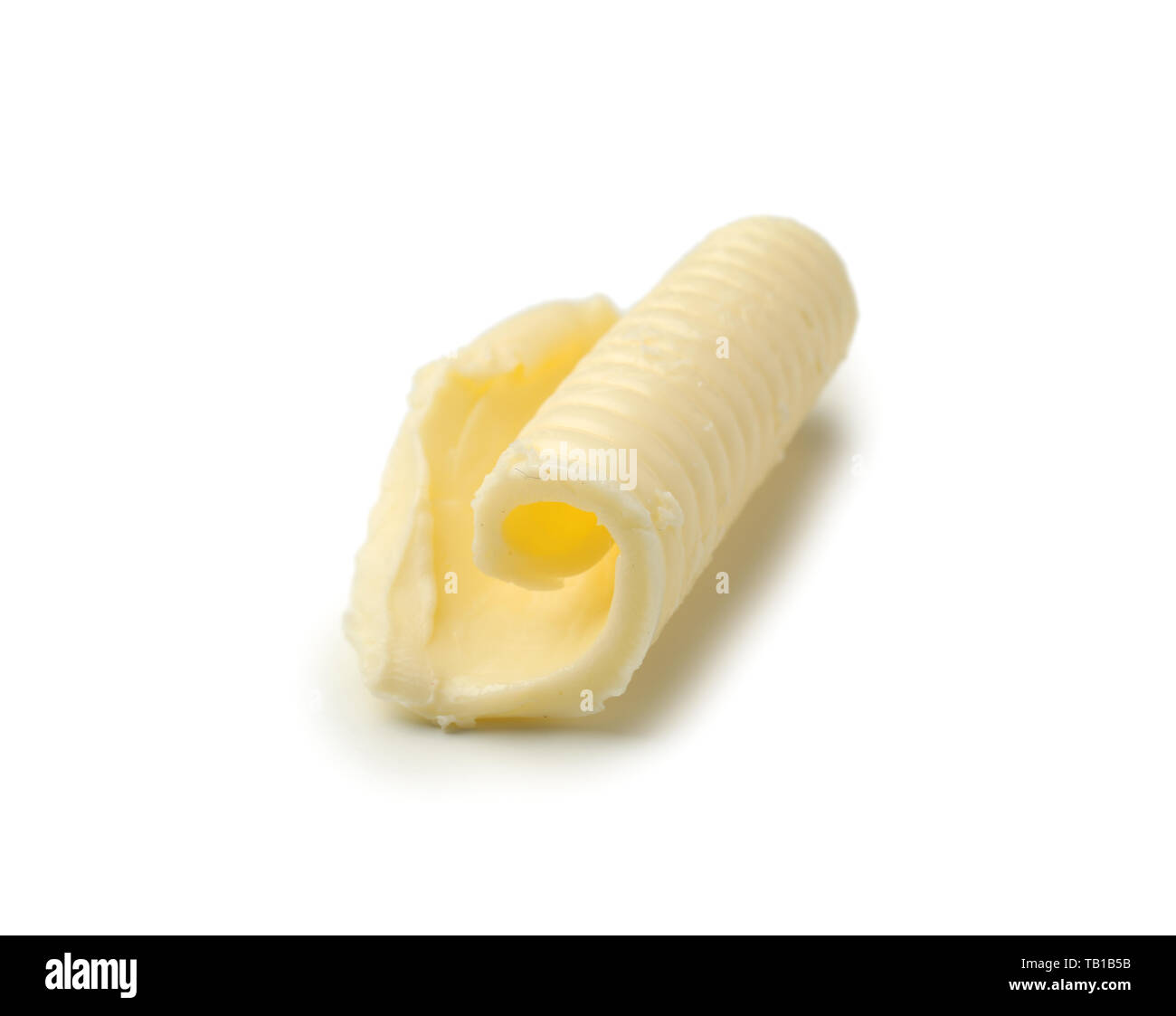 Fresh butter curl on white background Stock Photo - Alamy