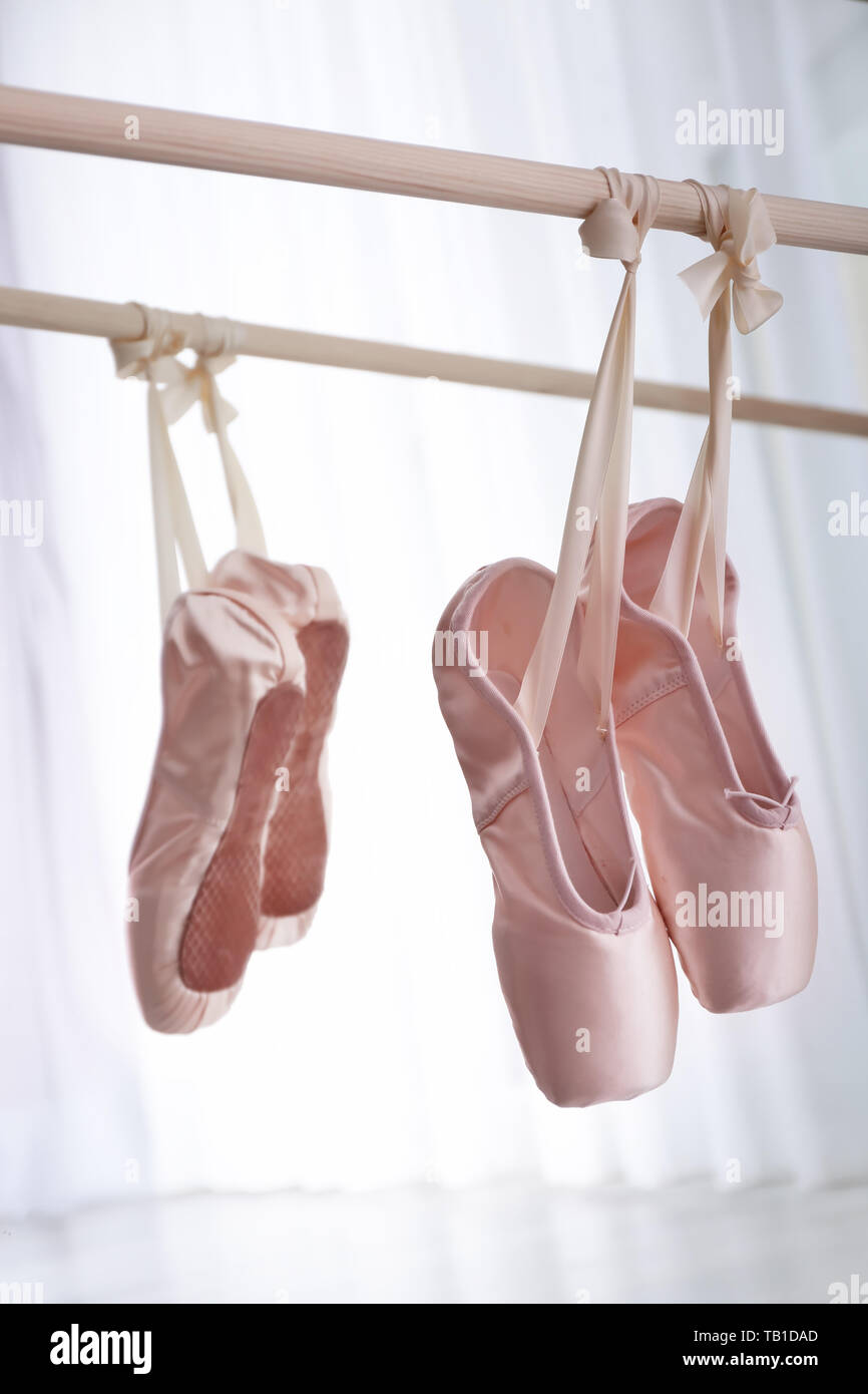 Ballet shoes hanging on bar in studio Stock Photo - Alamy