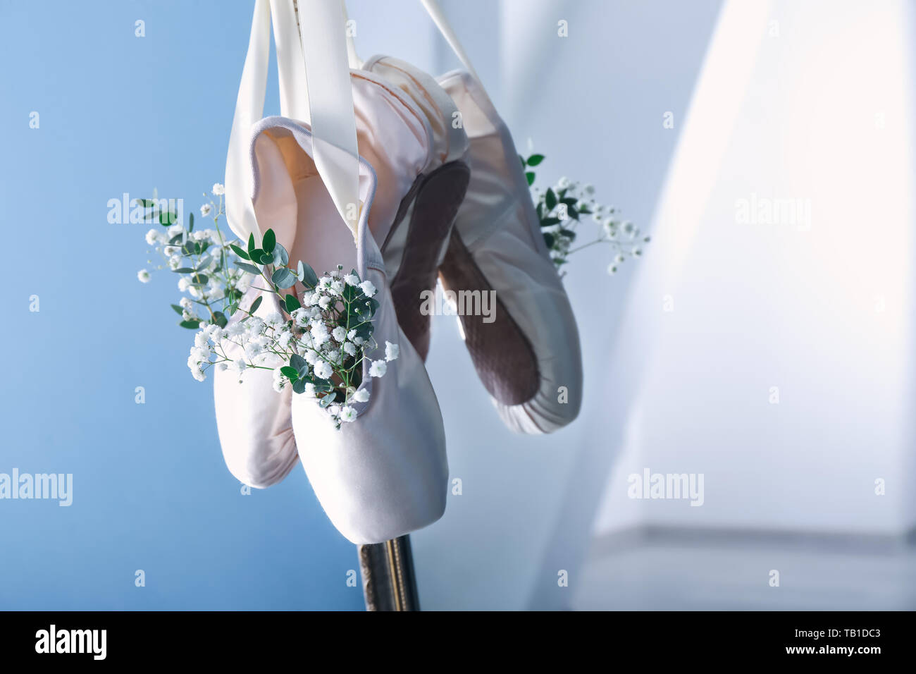 Hanging ballet shoes in studio Stock Photo - Alamy