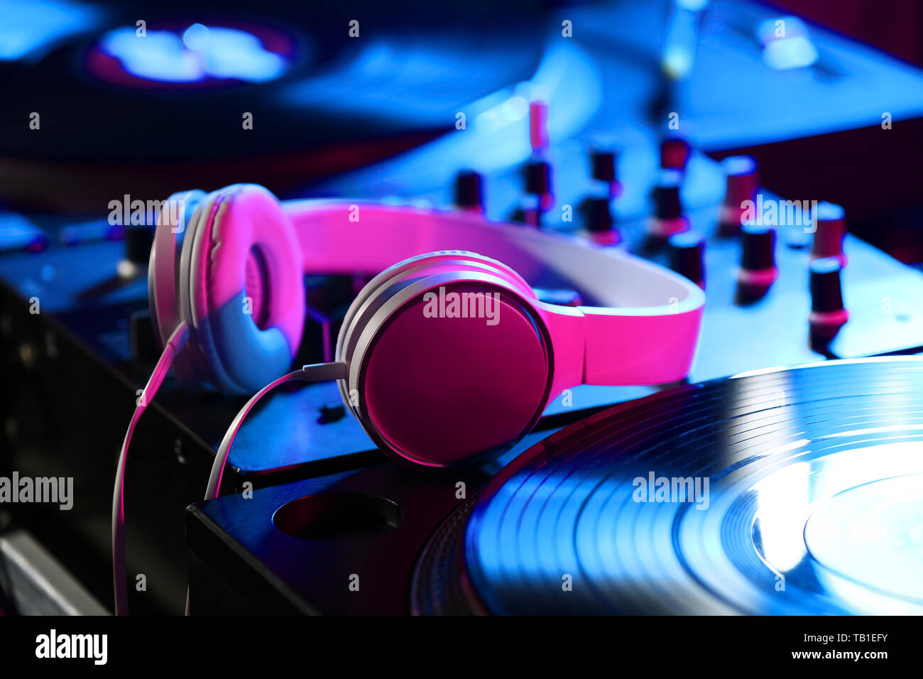 Headphones on modern DJ mixer, closeup Stock Photo - Alamy