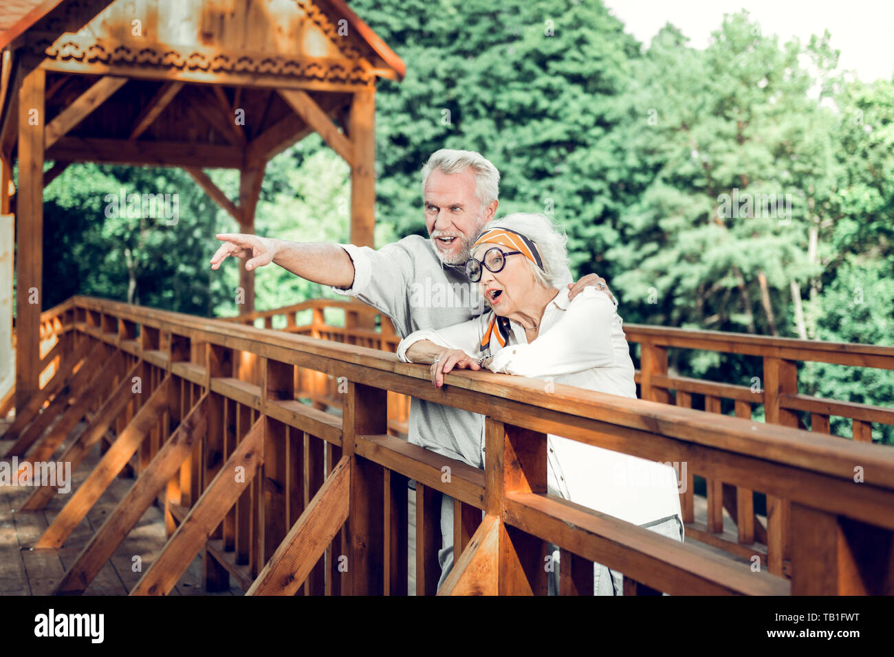 Attractive wife and husband standing on the wooden bridge Stock Photo ...