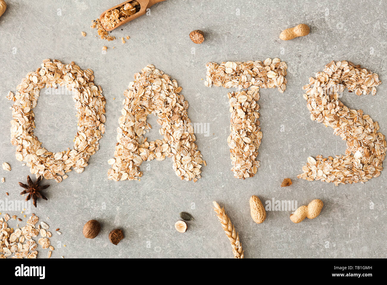 Word OATS made of flakes on grey table Stock Photo - Alamy