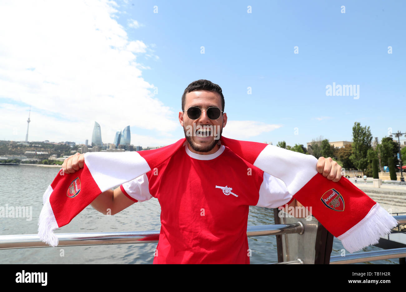 An Arsenal fan poses for a picture before the UEFA Europa League final ...