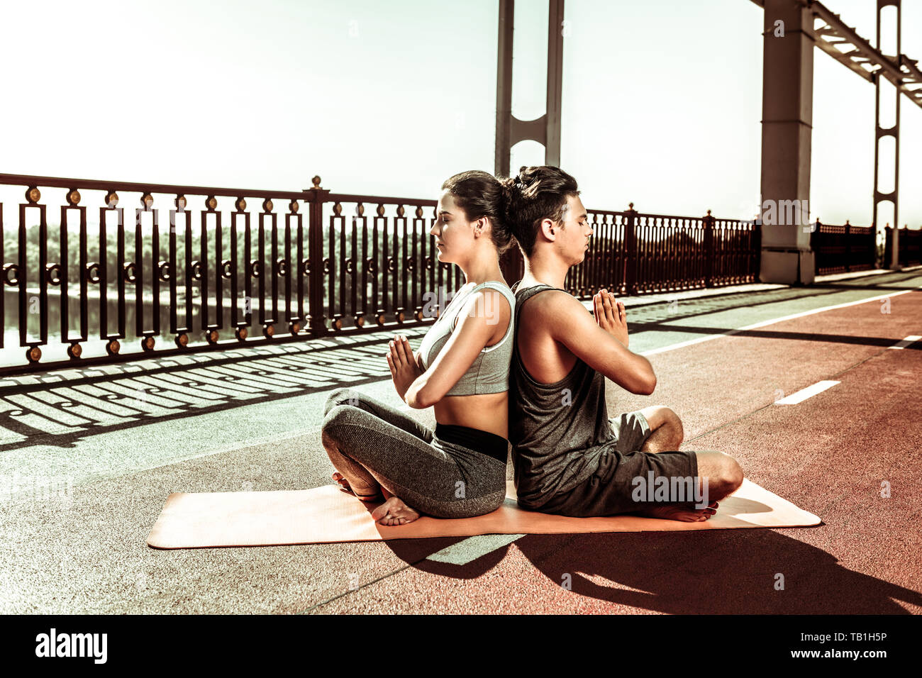 Young athletic man is doing bridge exercise hi-res stock photography ...
