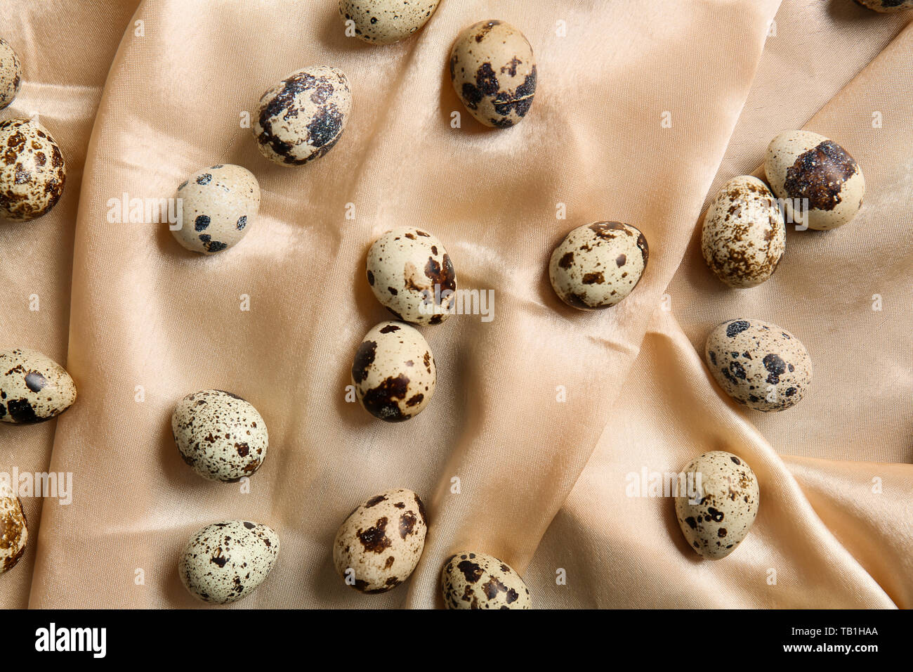Raw quail eggs on fabric Stock Photo - Alamy