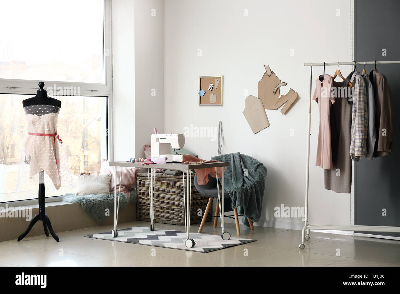 Stylish tailor's workplace in interior of workshop Stock Photo - Alamy