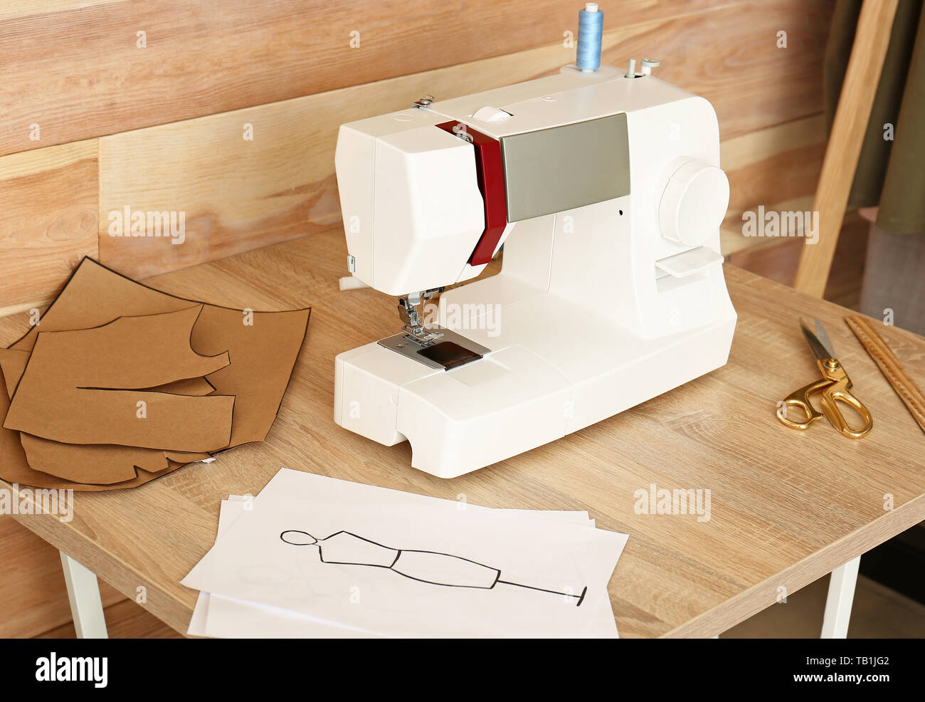 Sewing machine on tailor's workplace in atelier Stock Photo - Alamy