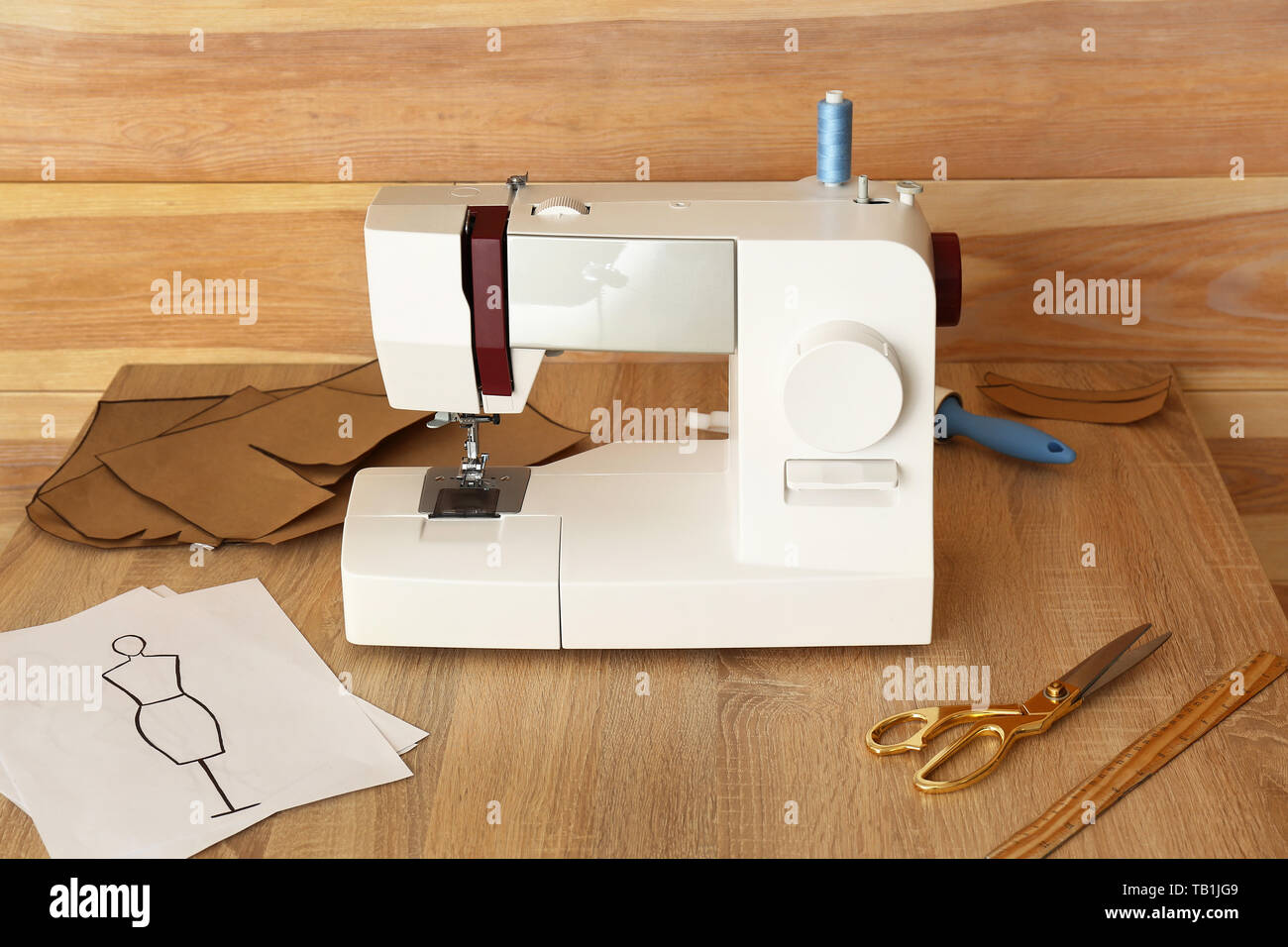 Sewing machine on tailor's workplace in atelier Stock Photo - Alamy