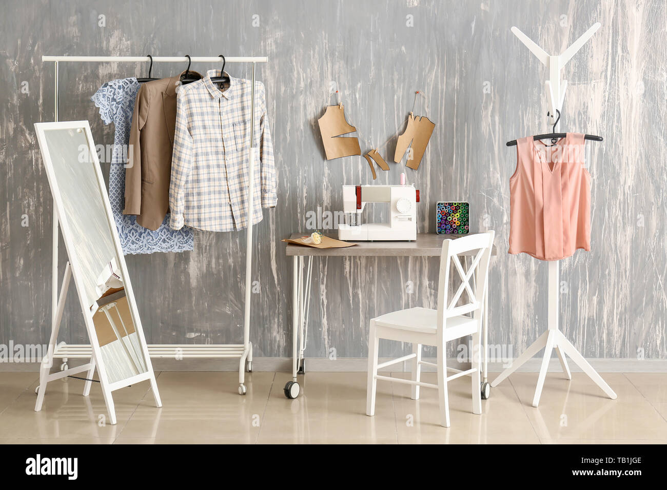 Stylish tailor's workplace in interior of workshop Stock Photo - Alamy