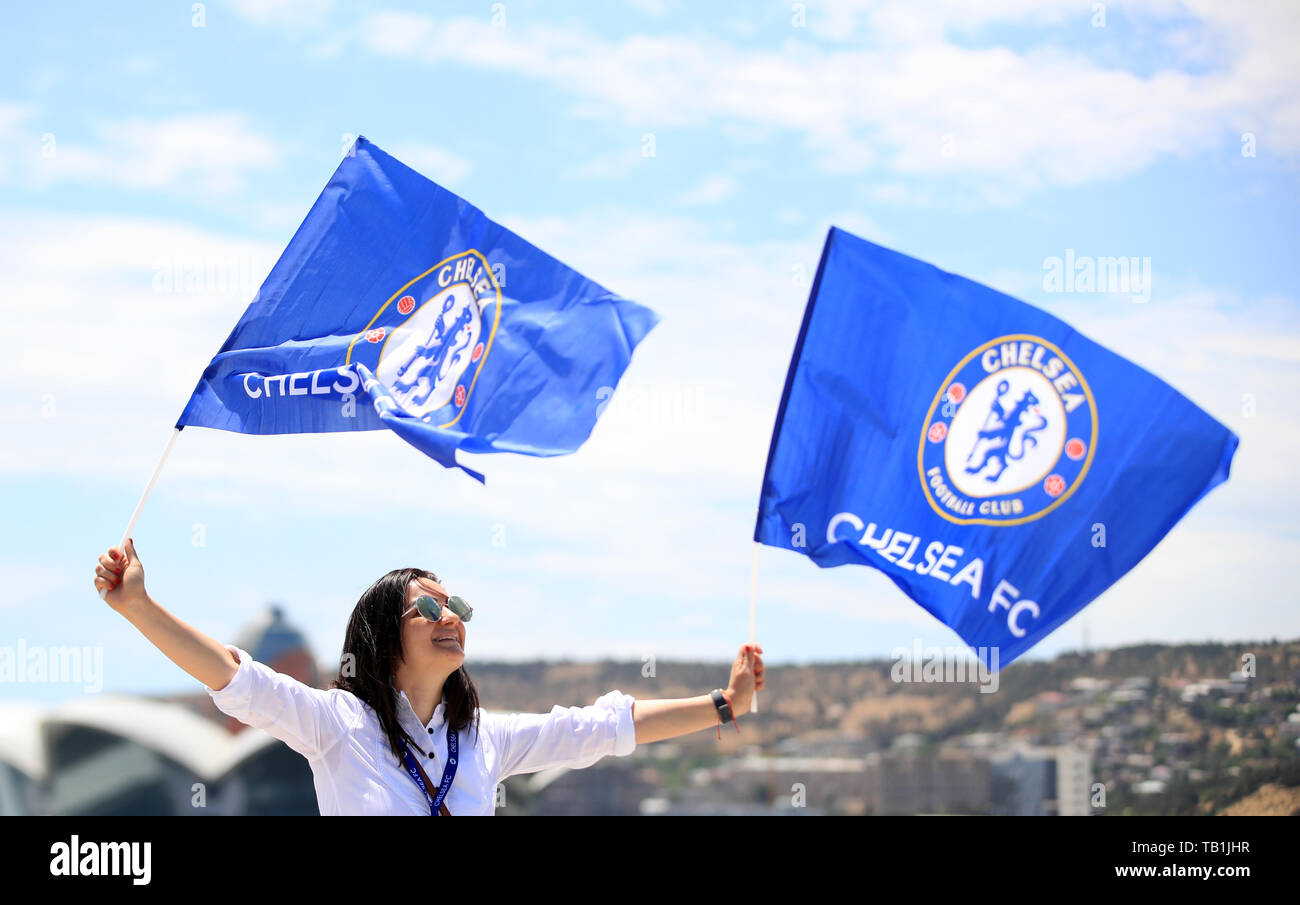 A fan waves Chelsea flags in Dovlet Bayraq Meydani before the UEFA ...