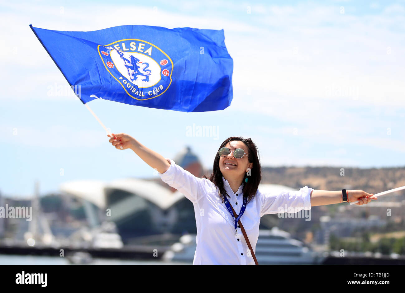 A fan waves Chelsea flags in Dovlet Bayraq Meydani before the UEFA ...