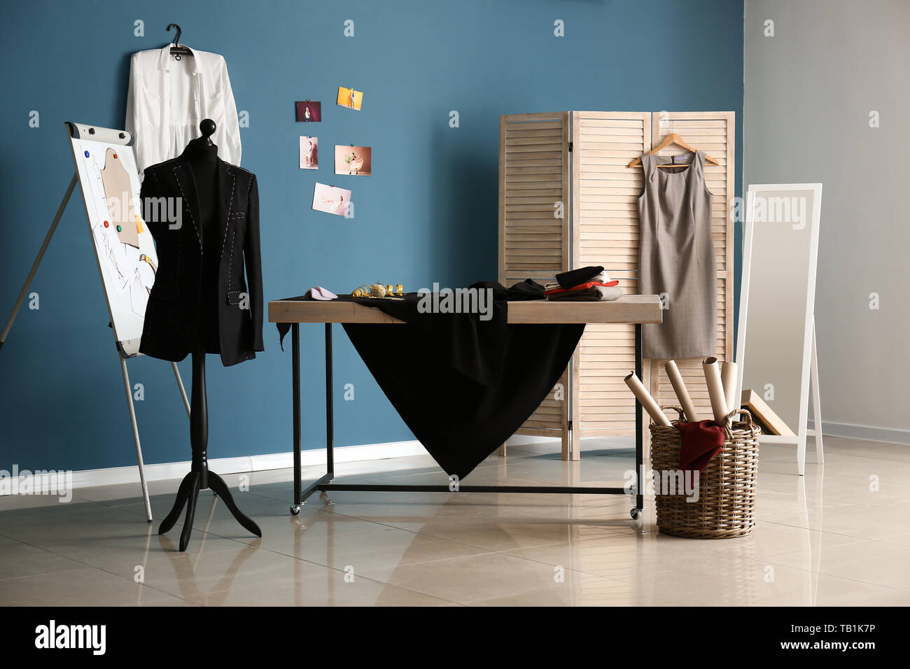 Stylish tailor's workplace in interior of workshop Stock Photo - Alamy