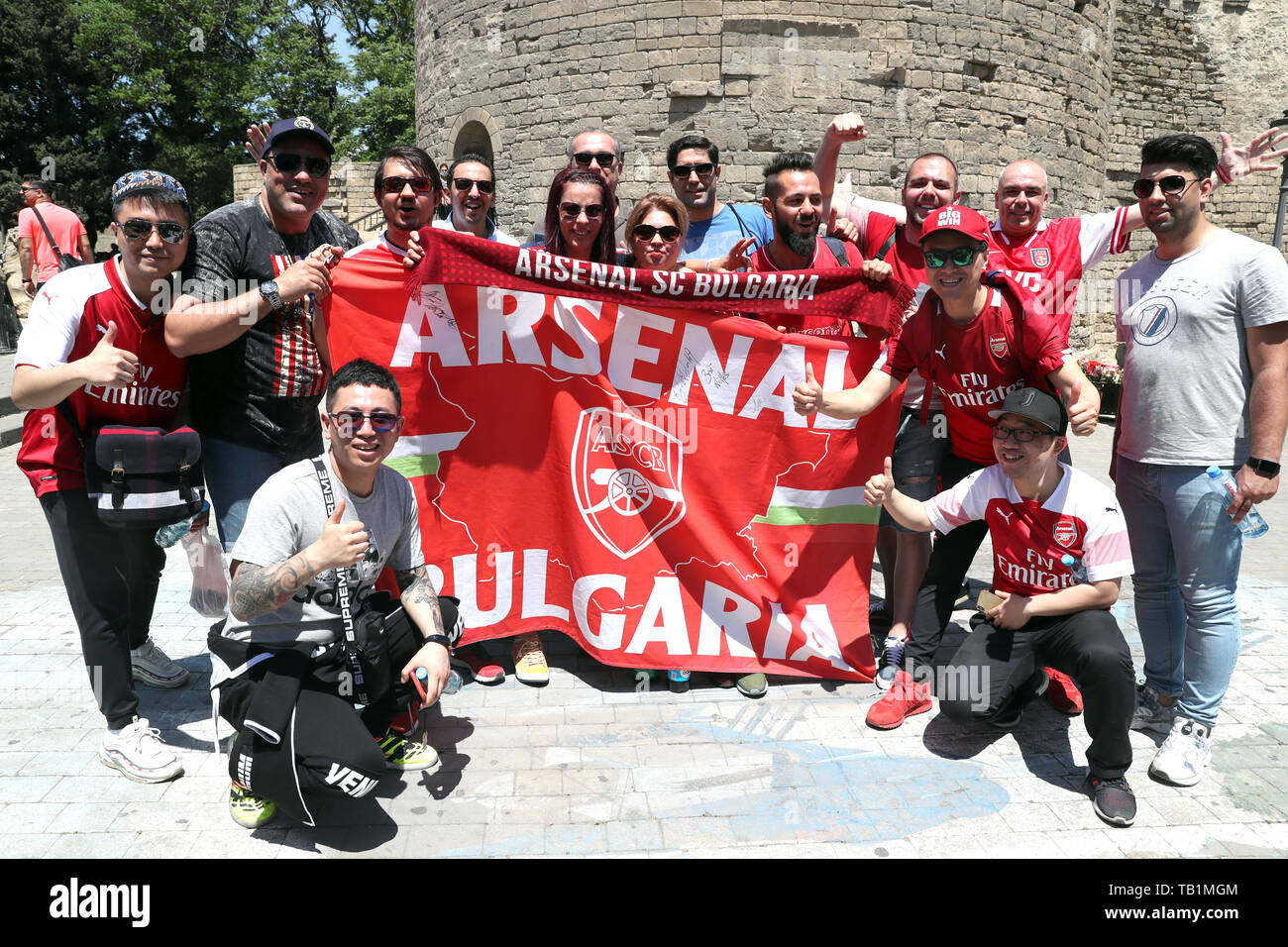 Arsenal fans pose for a picture in front of Maiden Tower before the ...