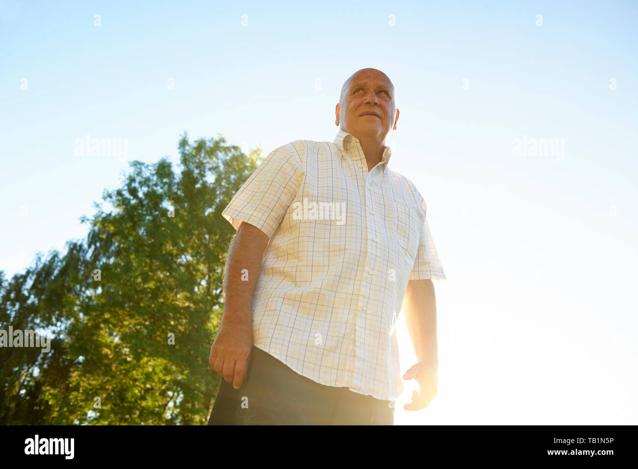 Low angle portrait of a healthy and happy looking caucasian elderly man ...