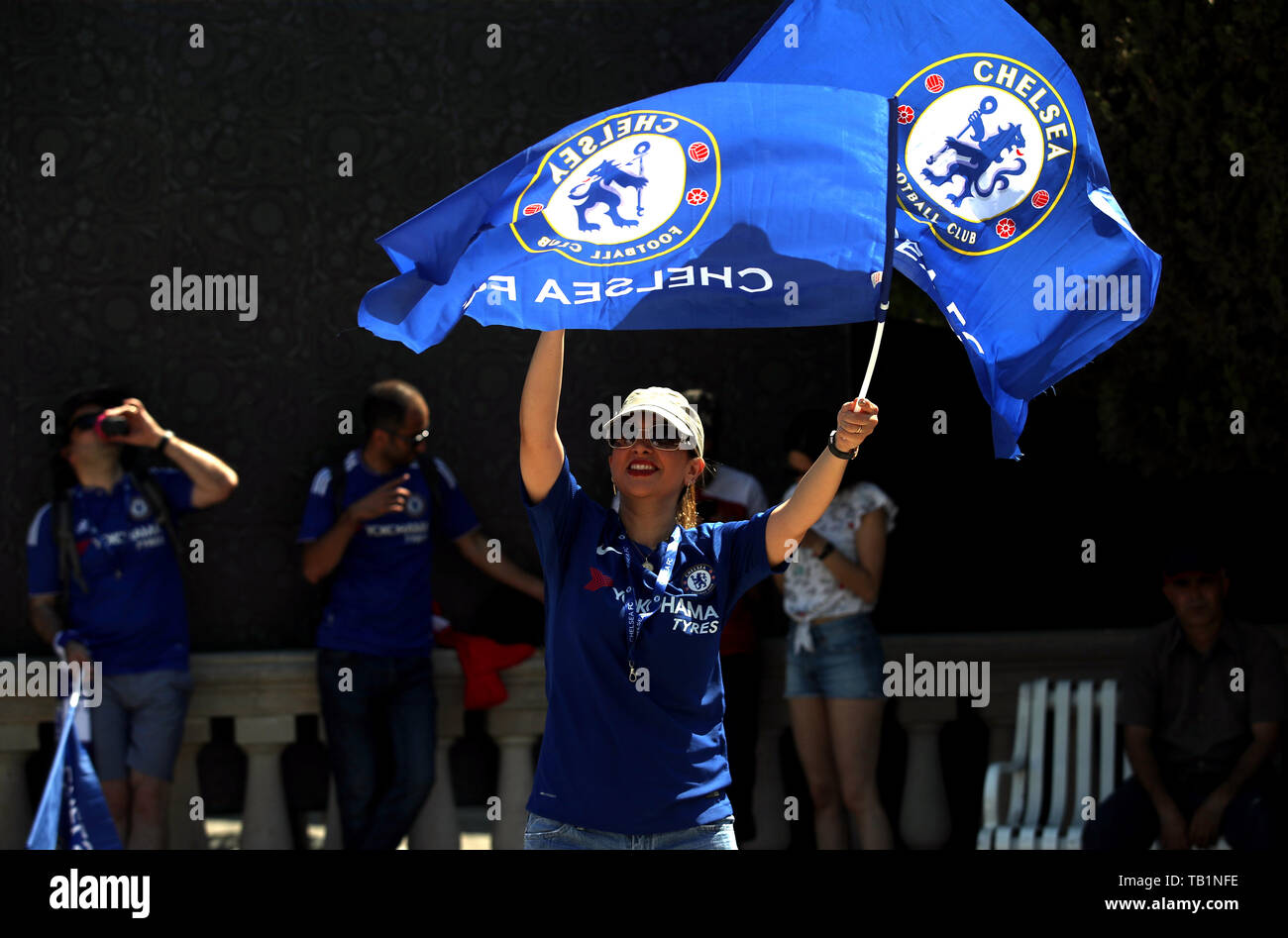 A Chelsea fan waves flags before the UEFA Europa League final at The ...