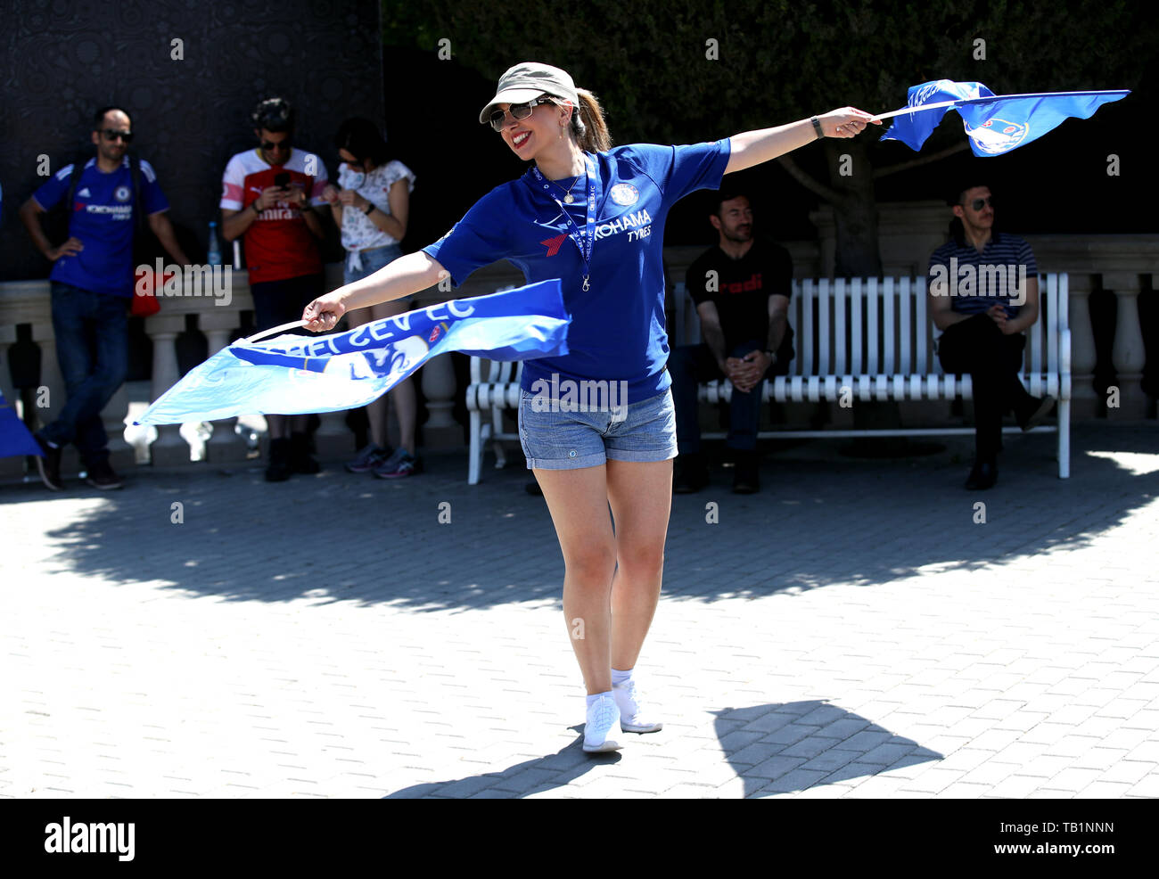 A Chelsea fan waves flags before the UEFA Europa League final at The ...