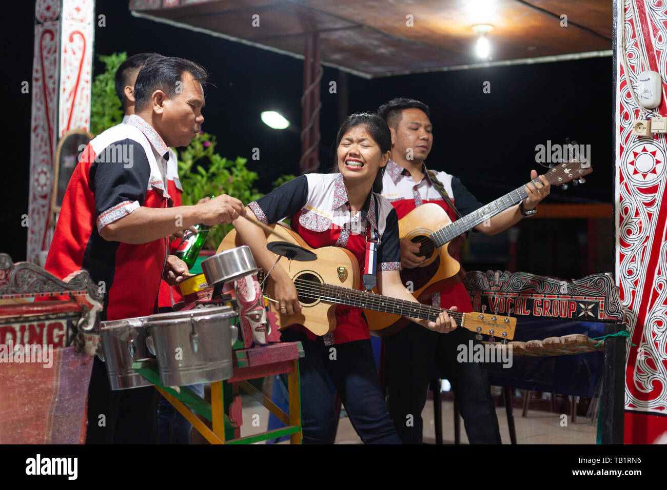 Traditional Batak family band performs in Tuk Tuk, Samosir Island, Lake ...