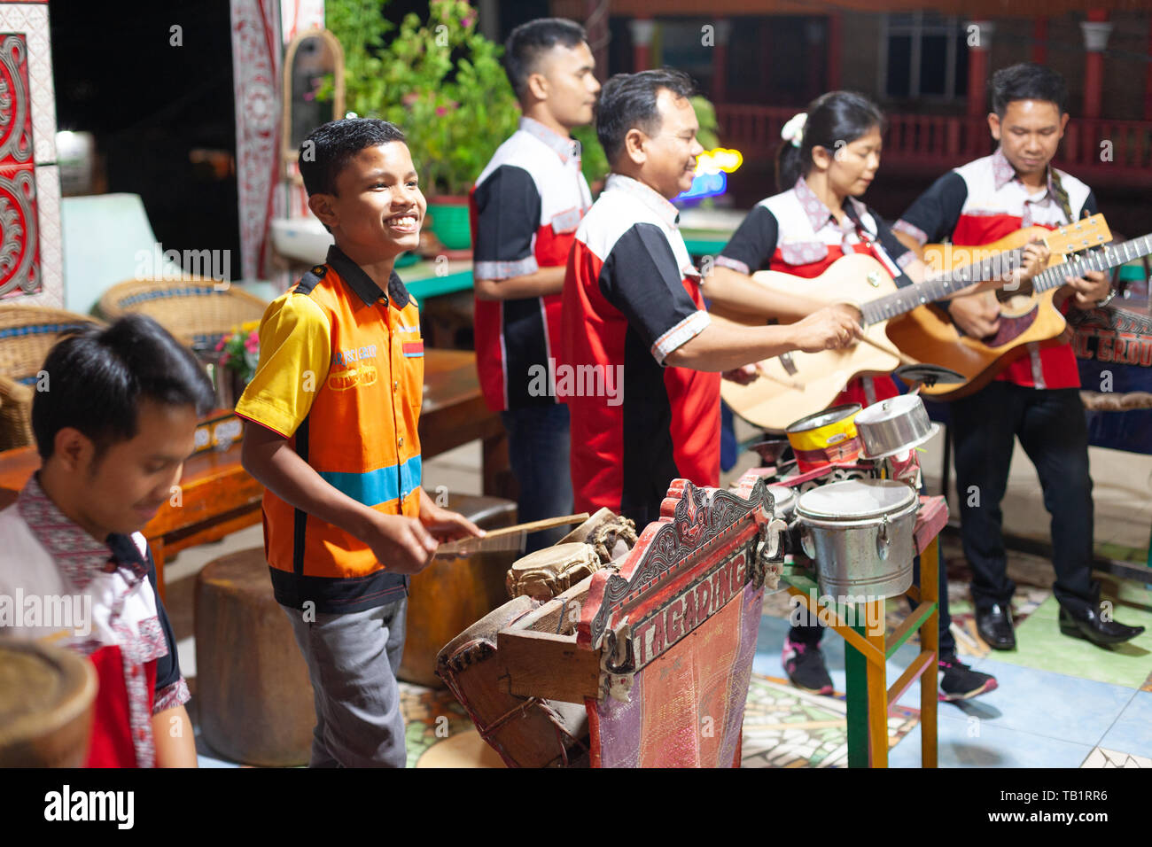 Traditional Batak family band performs in Tuk Tuk, Samosir Island, Lake ...