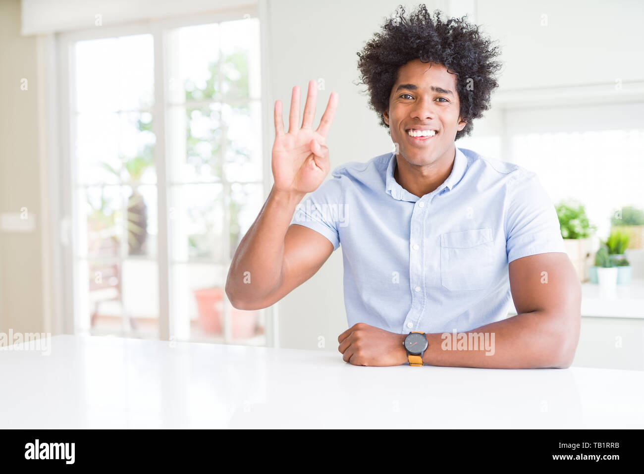 African American business man showing and pointing up with fingers ...