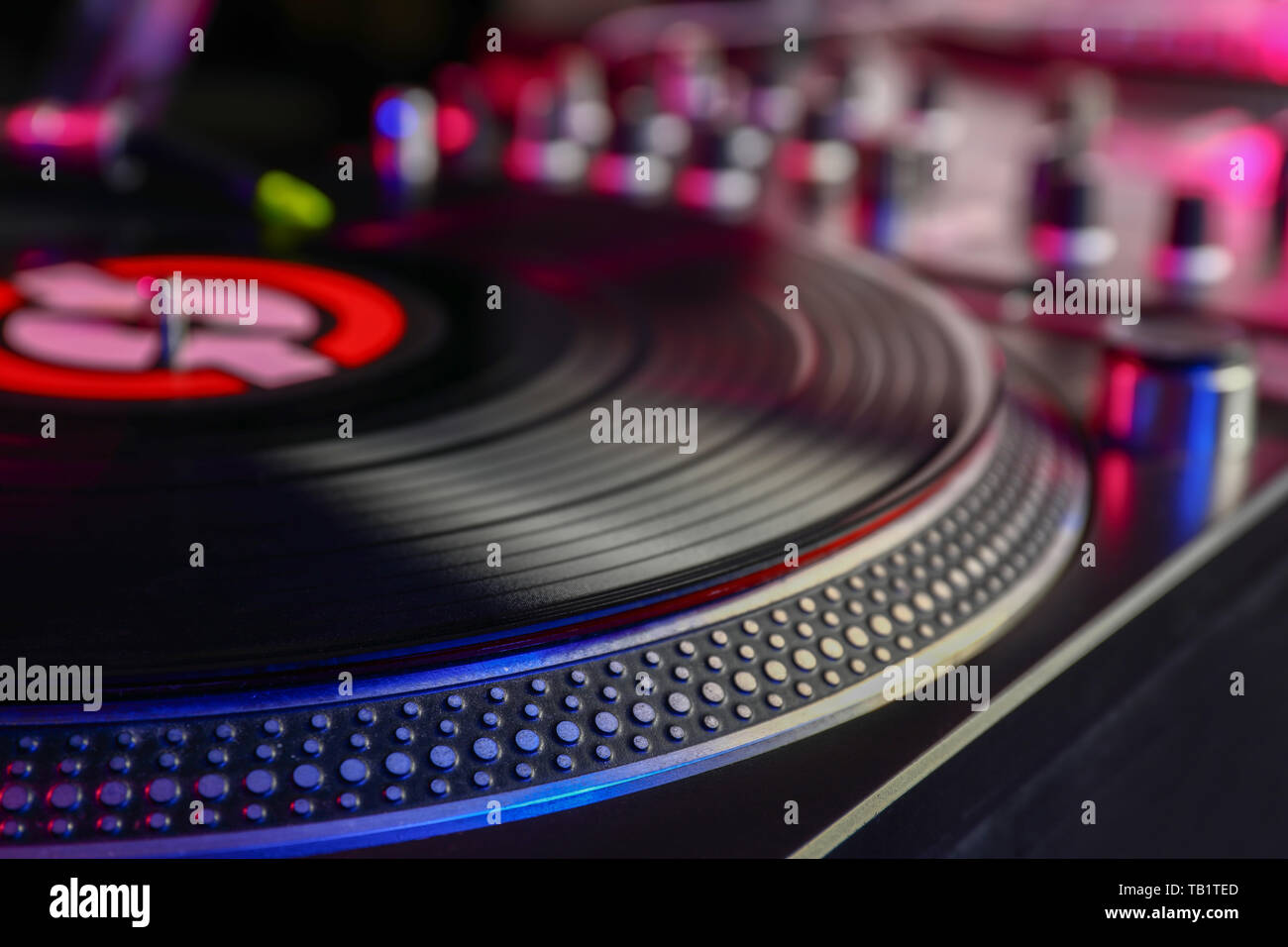 Vinyl disk on modern DJ mixer, closeup Stock Photo - Alamy