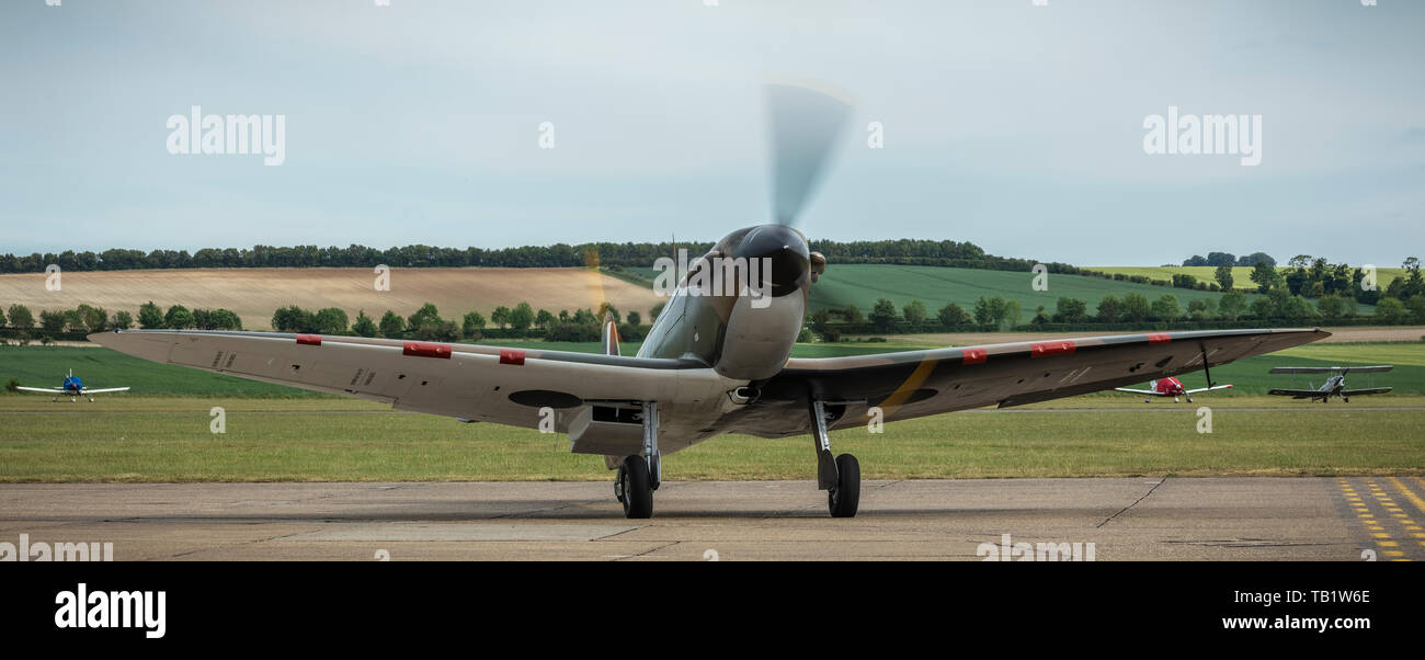 Spitfire Airplane on the ground on the runway at the Duxford Air Show ...
