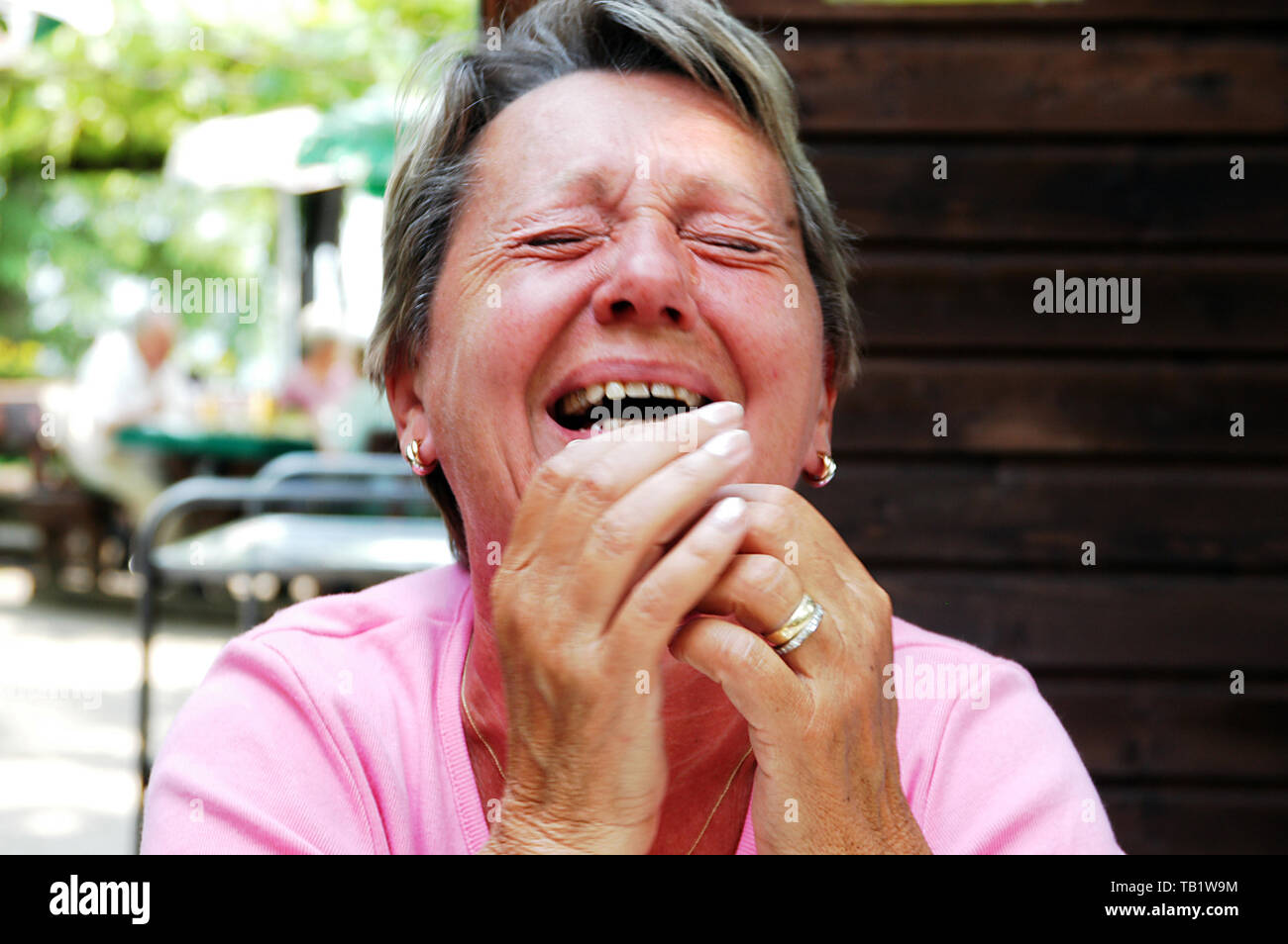 Healthy And Happy Elderly Woman Enjoying Herself In Summer Sunshine