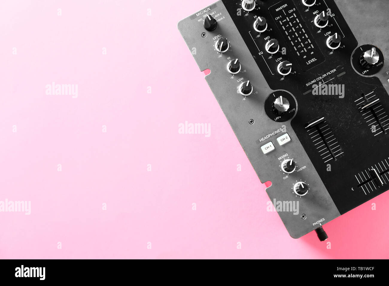 Modern DJ mixer on color background Stock Photo - Alamy