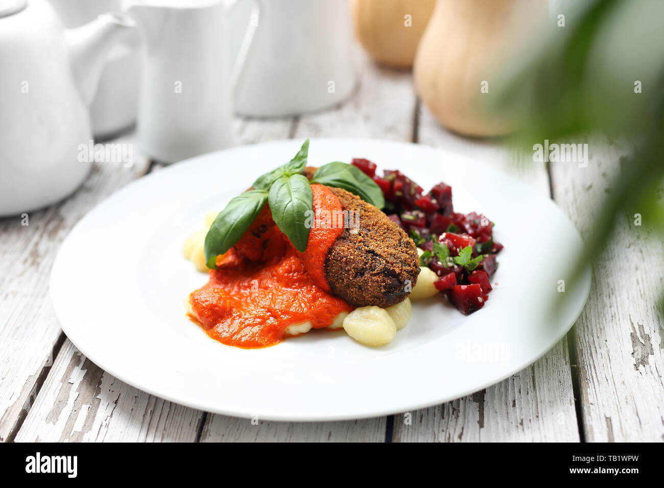 Appetizing dinner dish, vegetarian dish served on a white plate ...