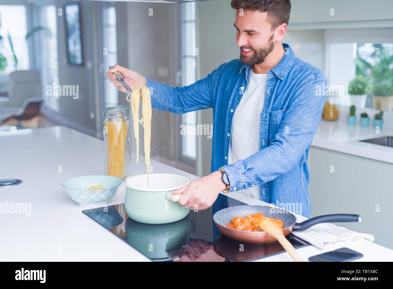 Hispanic boy eating pasta hi-res stock photography and images - Alamy
