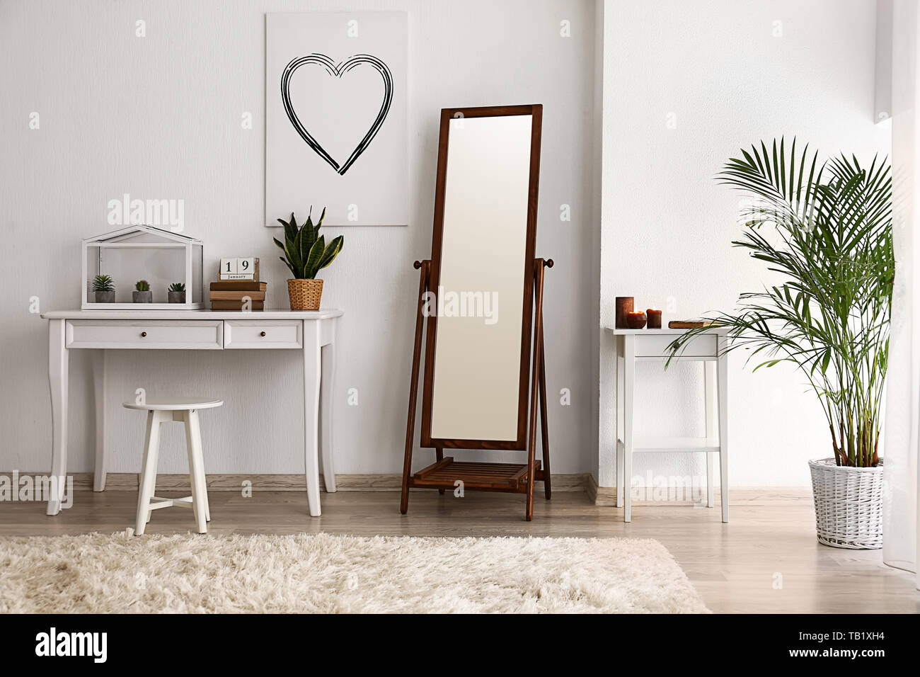 Interior of beautiful room with big mirror Stock Photo - Alamy