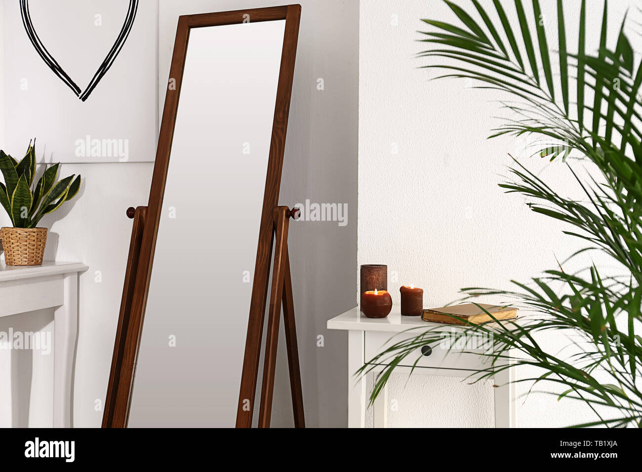 Interior of beautiful room with big mirror Stock Photo - Alamy