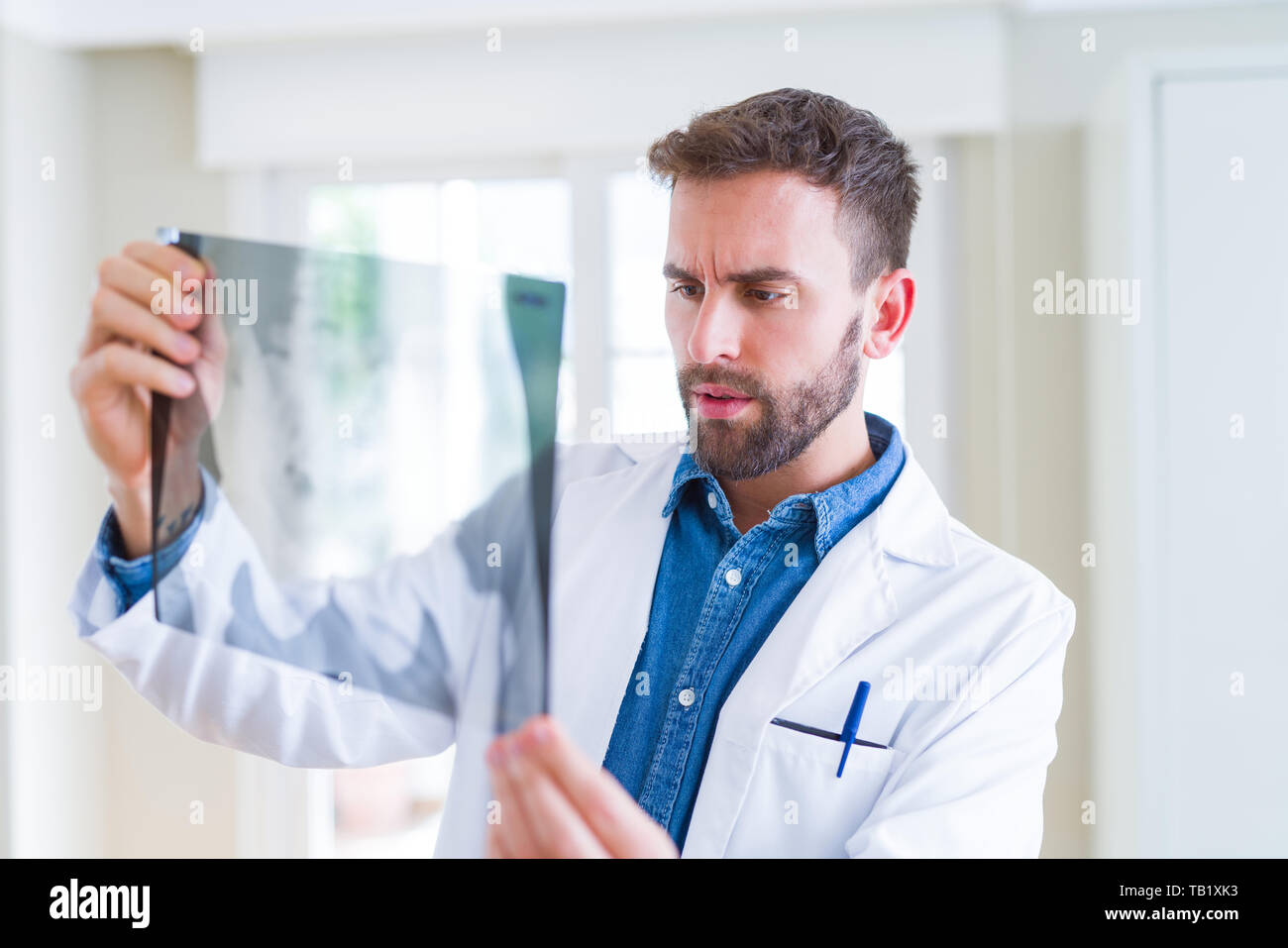 Doctor man looking at x-ray radiography doing body examination Stock ...