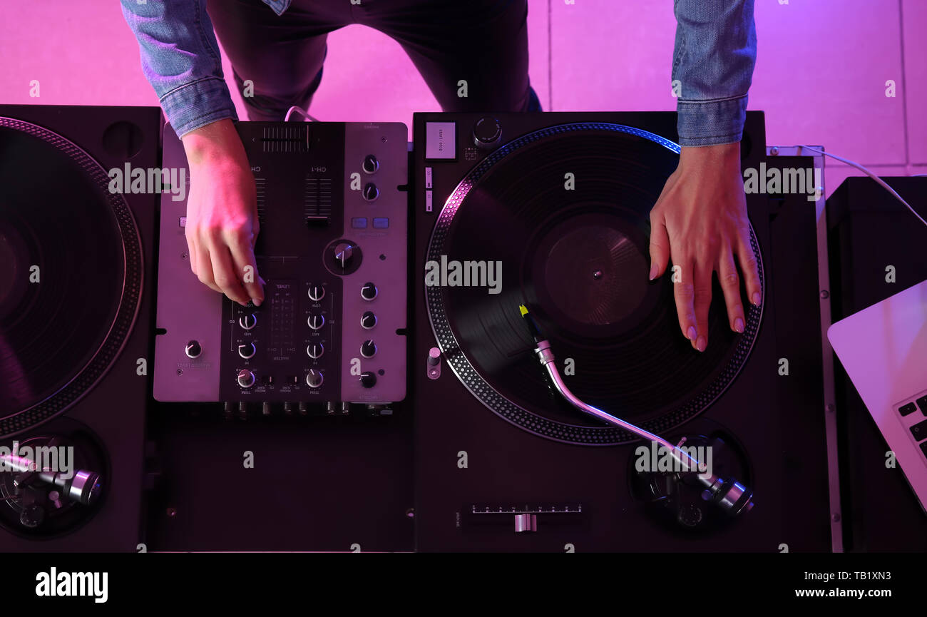Female DJ playing music in club, top view Stock Photo - Alamy