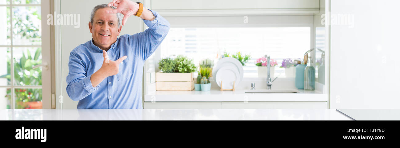 Wide angle perspective of handsome senior man at home smiling making ...