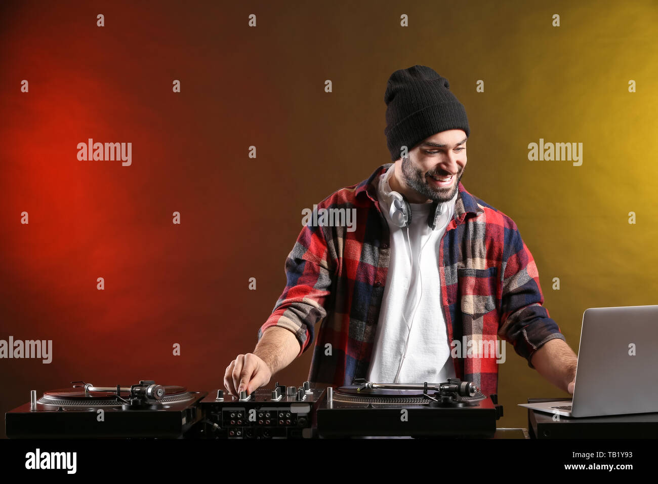 Male DJ playing music in club Stock Photo - Alamy