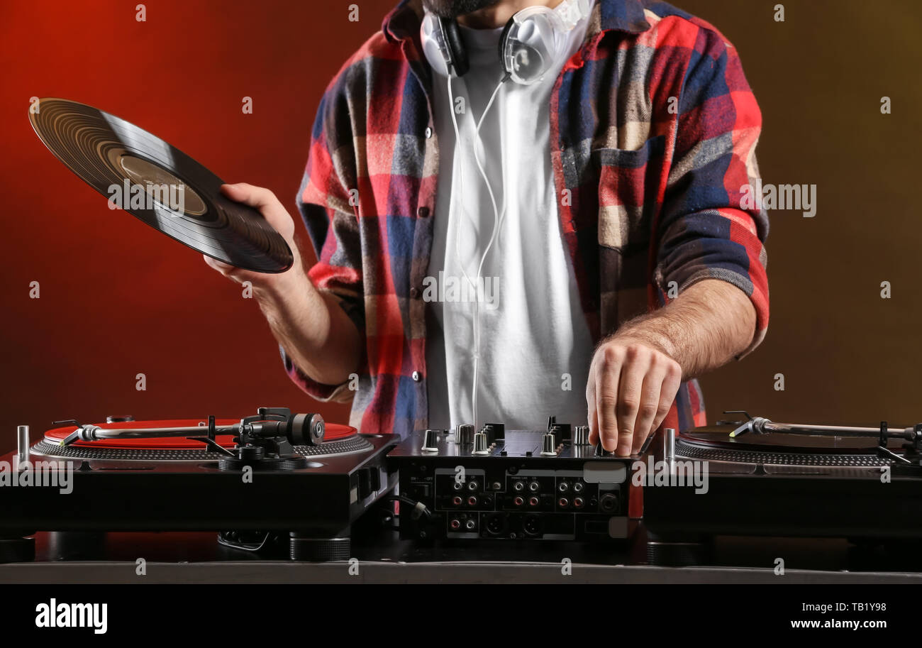 Male DJ playing music in club Stock Photo - Alamy