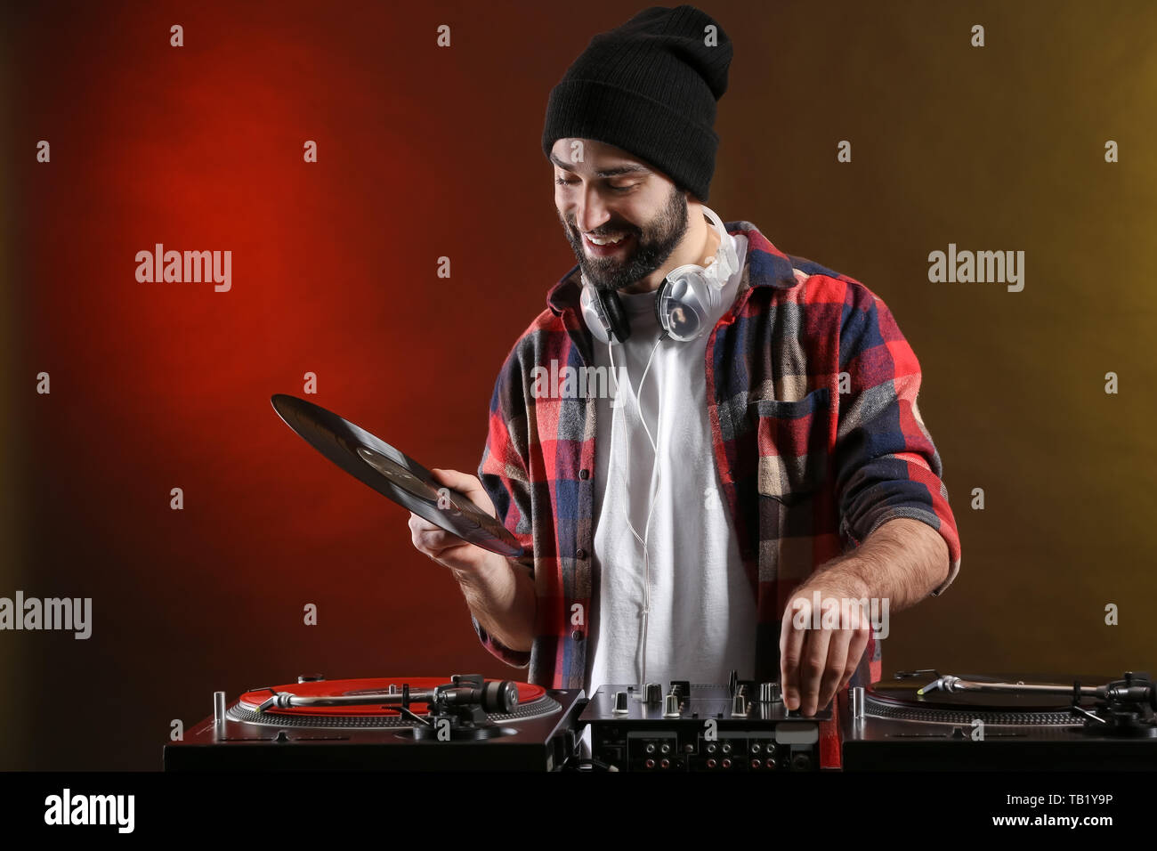 Male DJ playing music in club Stock Photo - Alamy