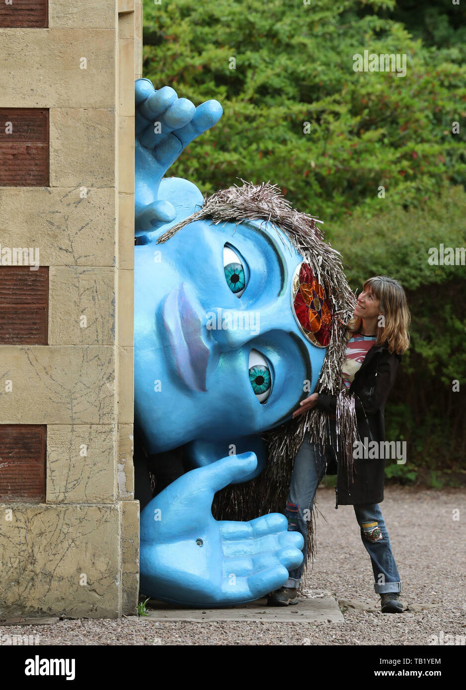 Kim Bergsaget with the UK's largest puppet, Big Man Walking as she trys ...