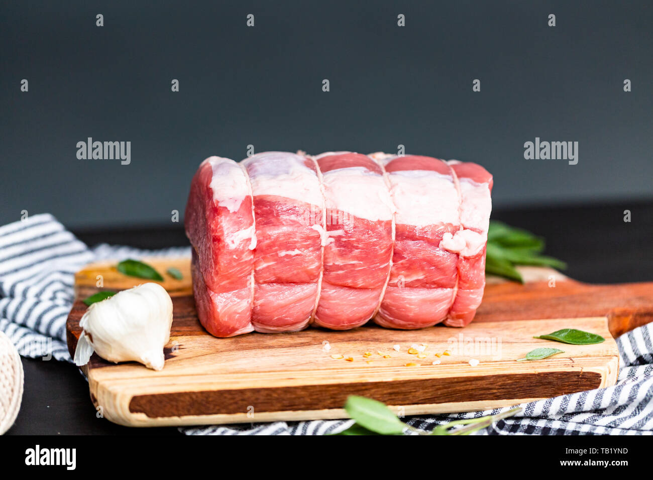 Uncooked boneless pork roast on the cutting board Stock Photo - Alamy