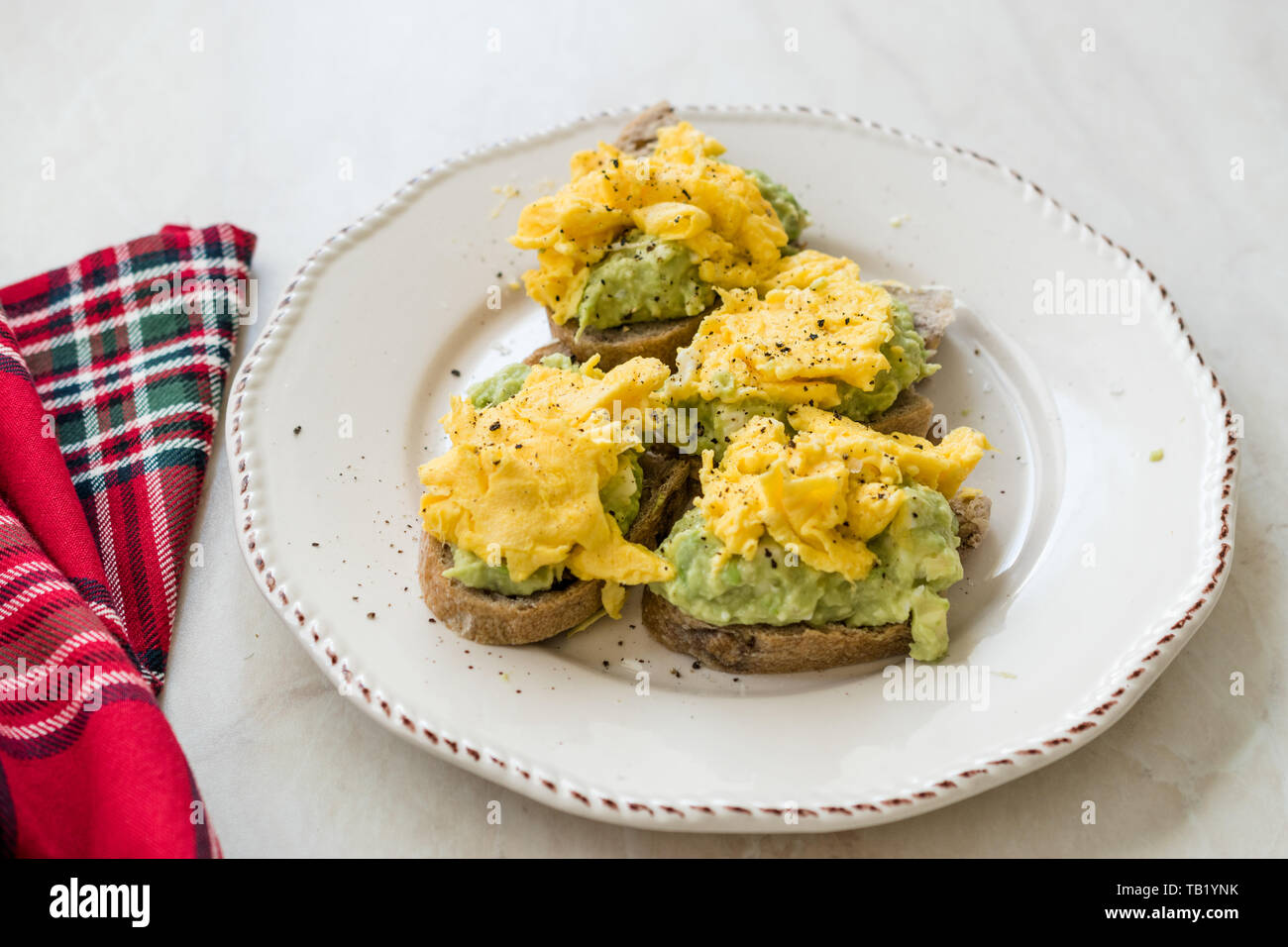 Scrambled Eggs with Avocado on Toast Bread for Breakfast. Organic Food ...